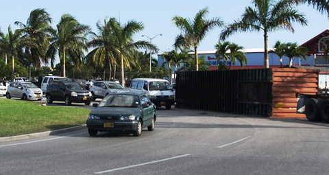 Truck loses container on roundabout - Cayman Compass