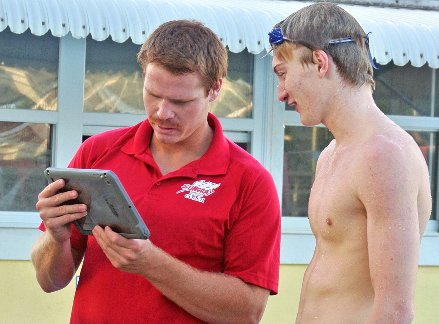 Swim club dives into technology - Cayman Compass