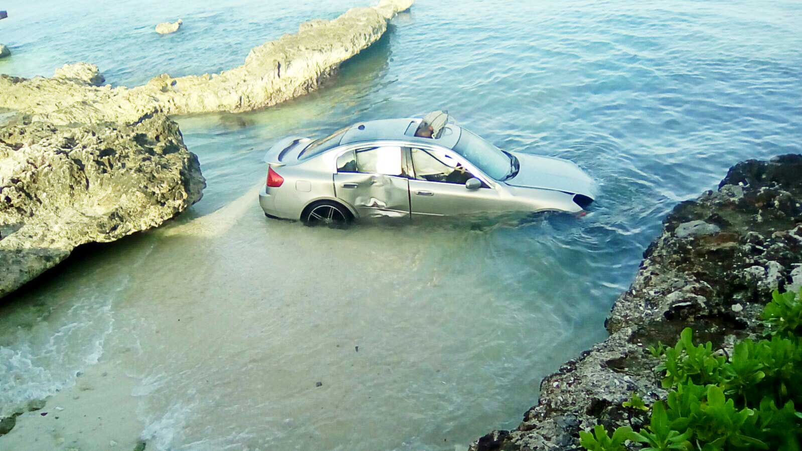 Car goes over wall into sea - Cayman Compass
