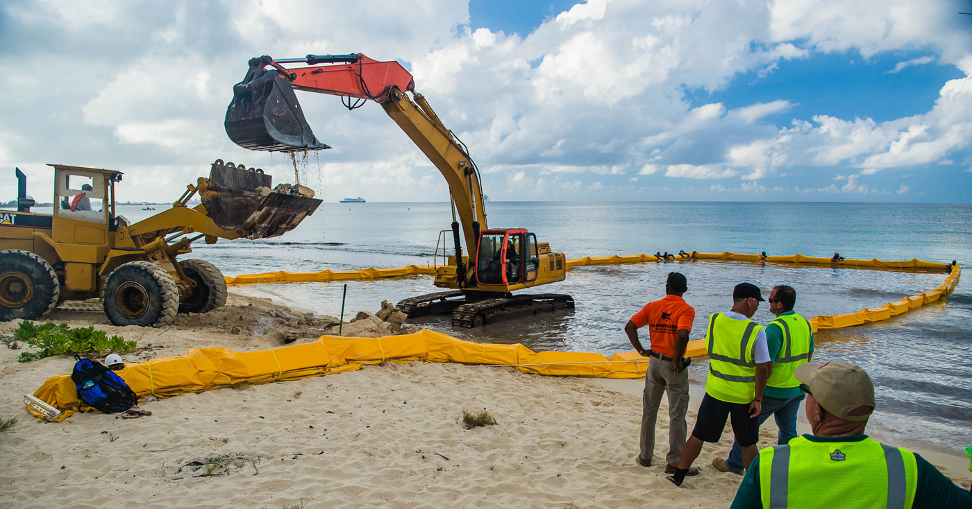 Rock removal trial begins on Seven Mile Beach - Cayman Compass