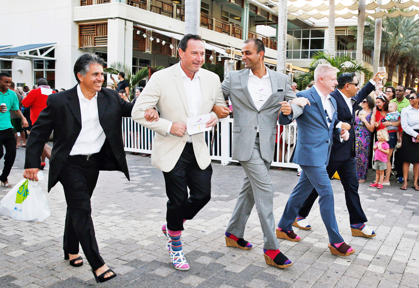 Men go mincing through Camana Bay for charity - Cayman Compass