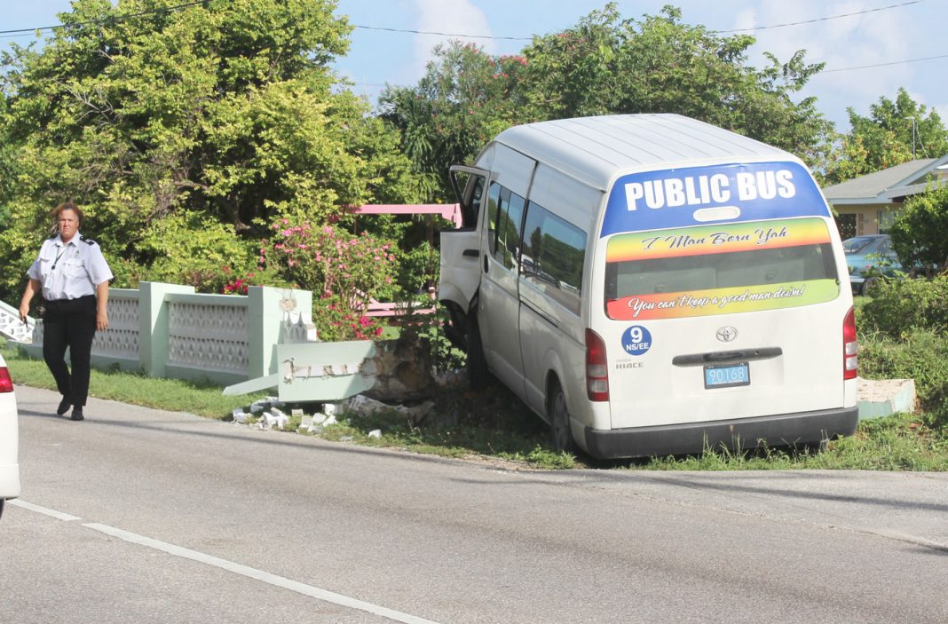 Public bus slams into wall with two passengers on board - Cayman Compass