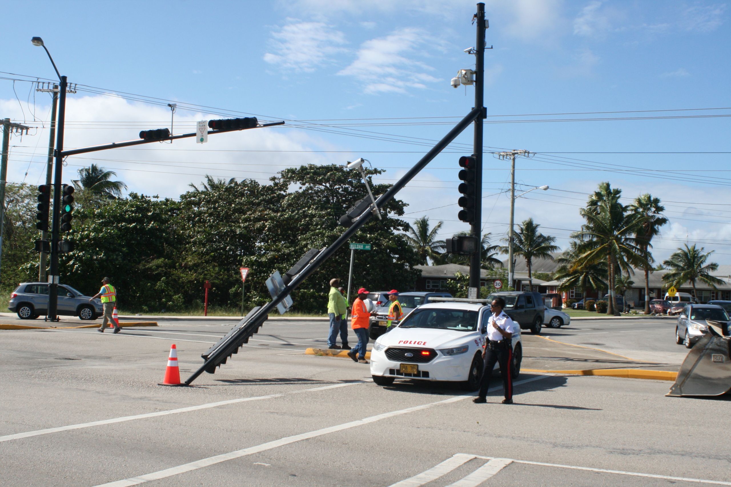 Light pole falls on road - Cayman Compass