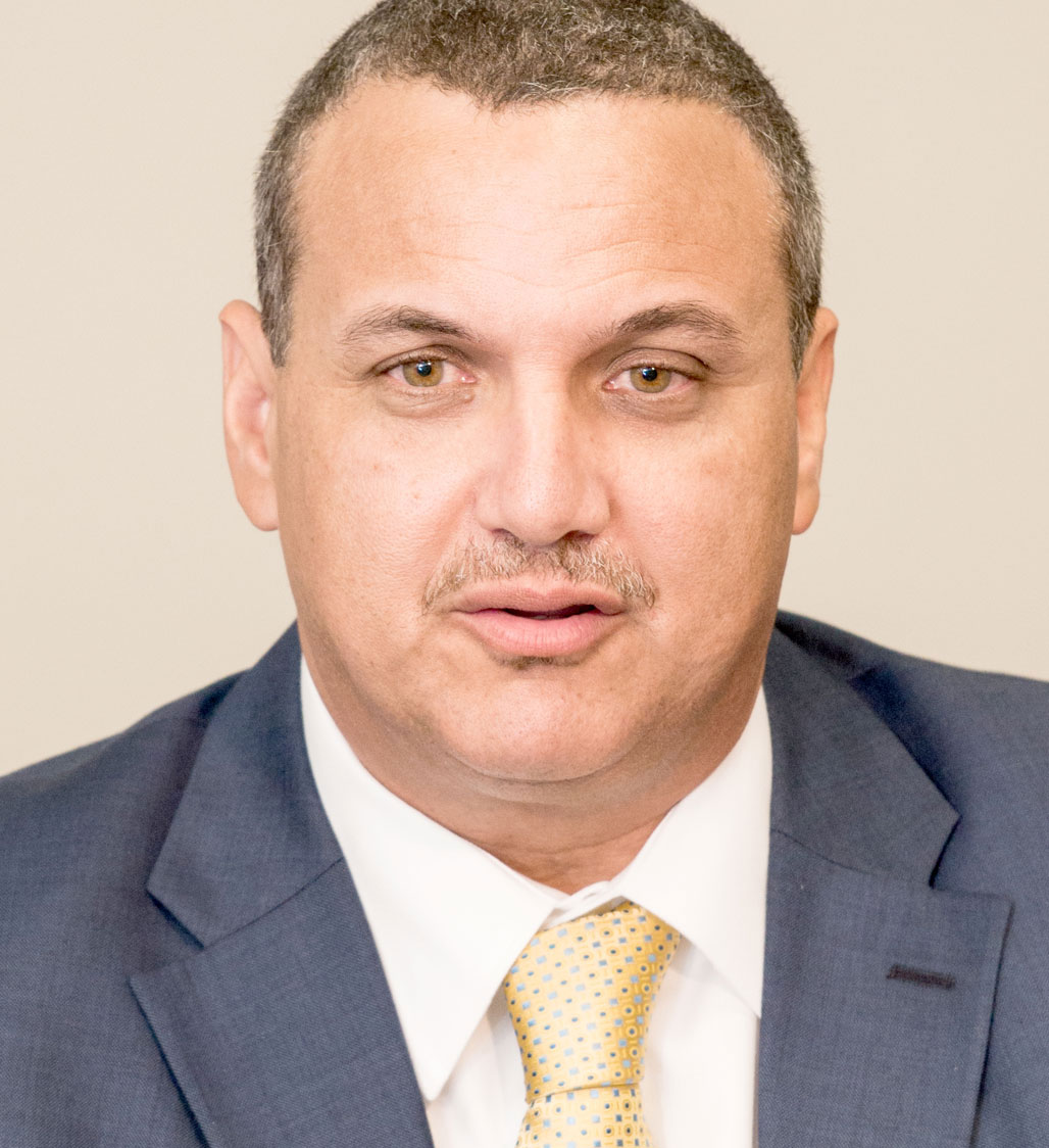 Government hiring fight could go to court - Cayman Compass