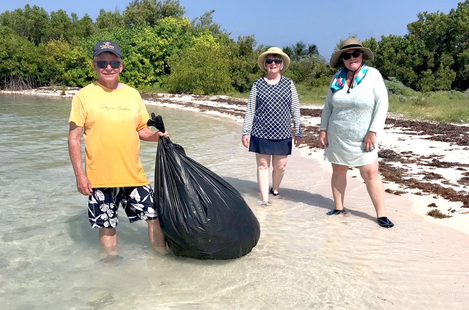 Music fans help clean up Owen Island - Cayman Compass