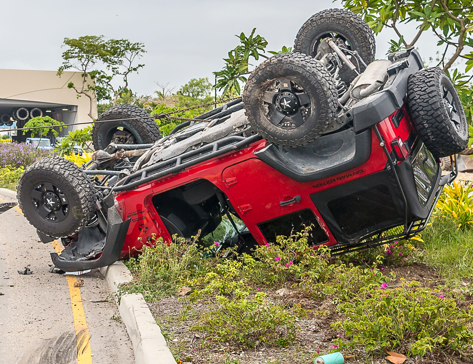 Jeep overturns in crash - Cayman Compass
