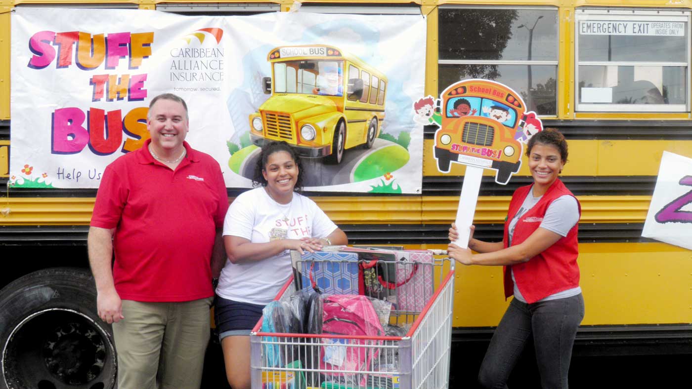 Cost-U-Less-Donates-a-Shopping-Cart-full-of-supplies - Cayman Compass