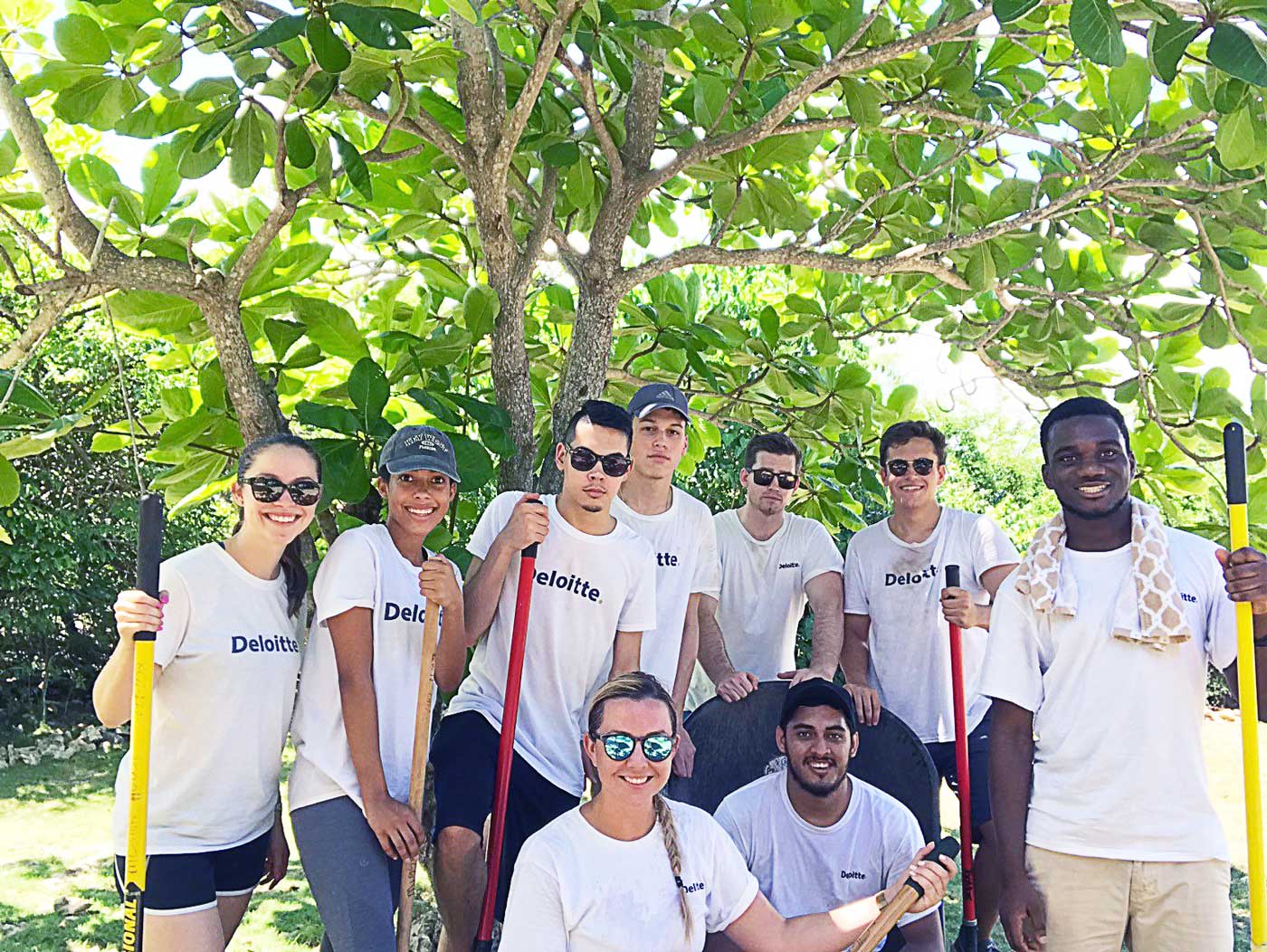 Deloitte interns volunteer at charities - Cayman Compass