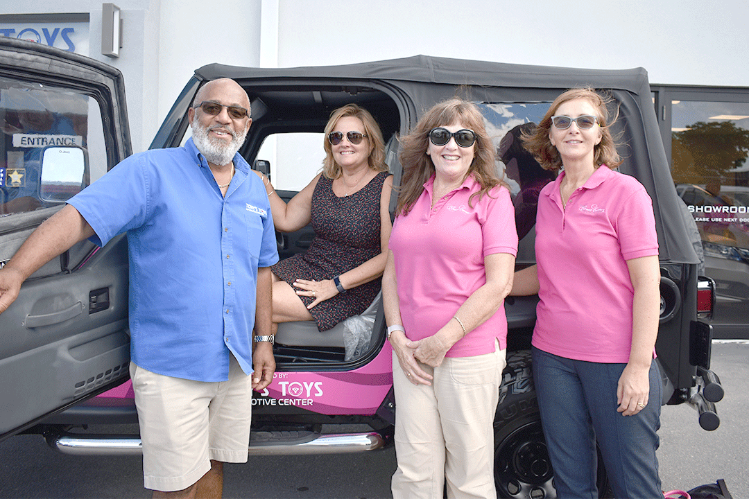 Jeep winner claims prize - Cayman Compass