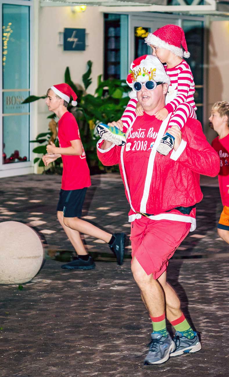 In Focus: Festive parade of Santas - Cayman Compass