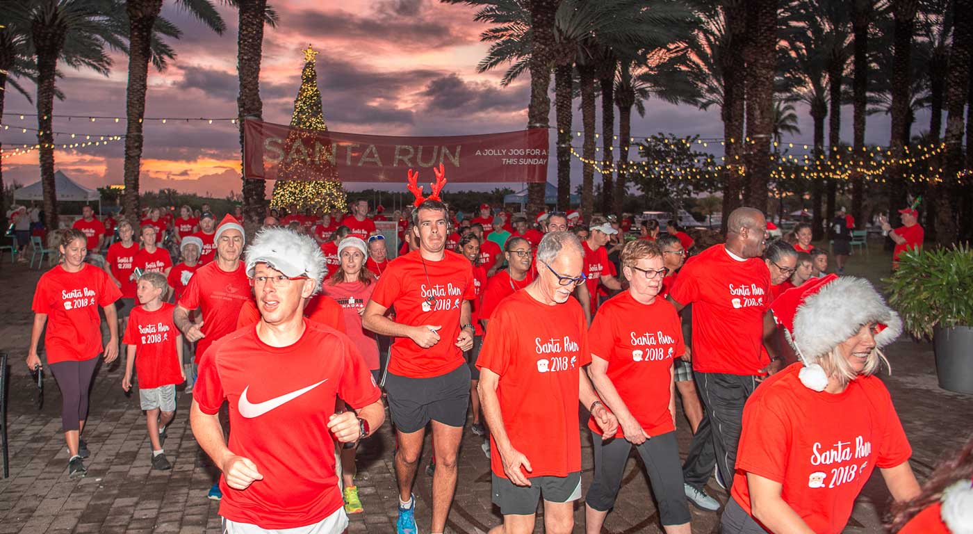 In Focus: Festive parade of Santas - Cayman Compass