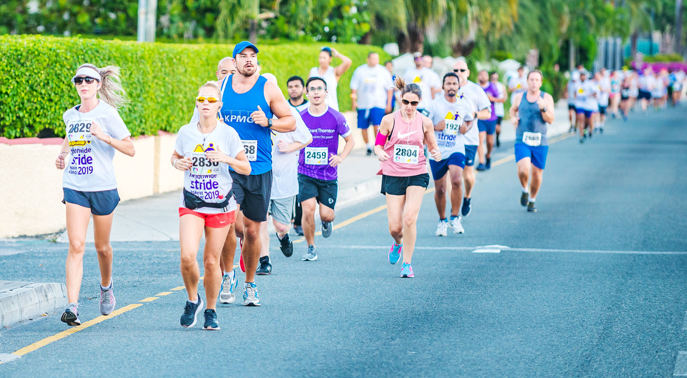 Runners take cancer fundraiser in their Stride - Cayman Compass