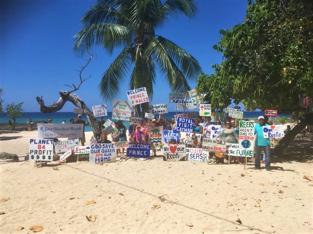 beach greeting protest - Cayman Compass