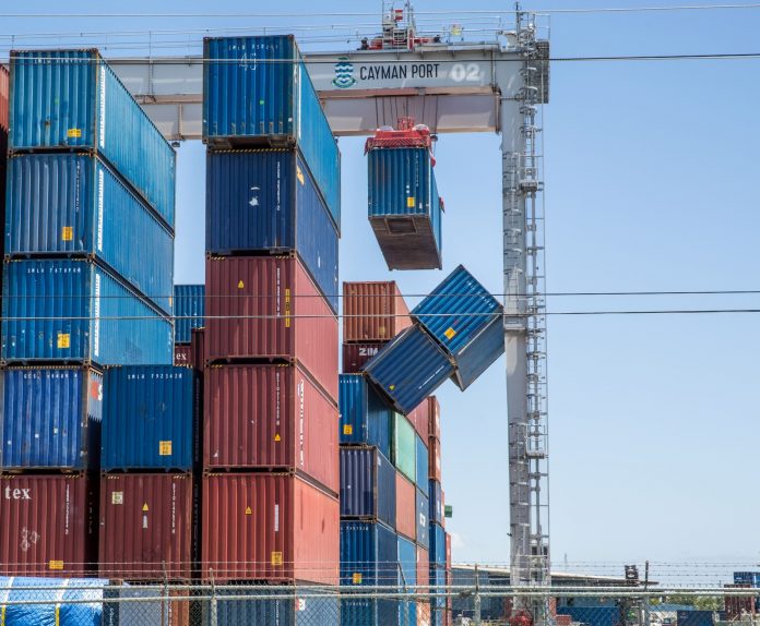 Containers topple over at cargo storage facility - Cayman Compass