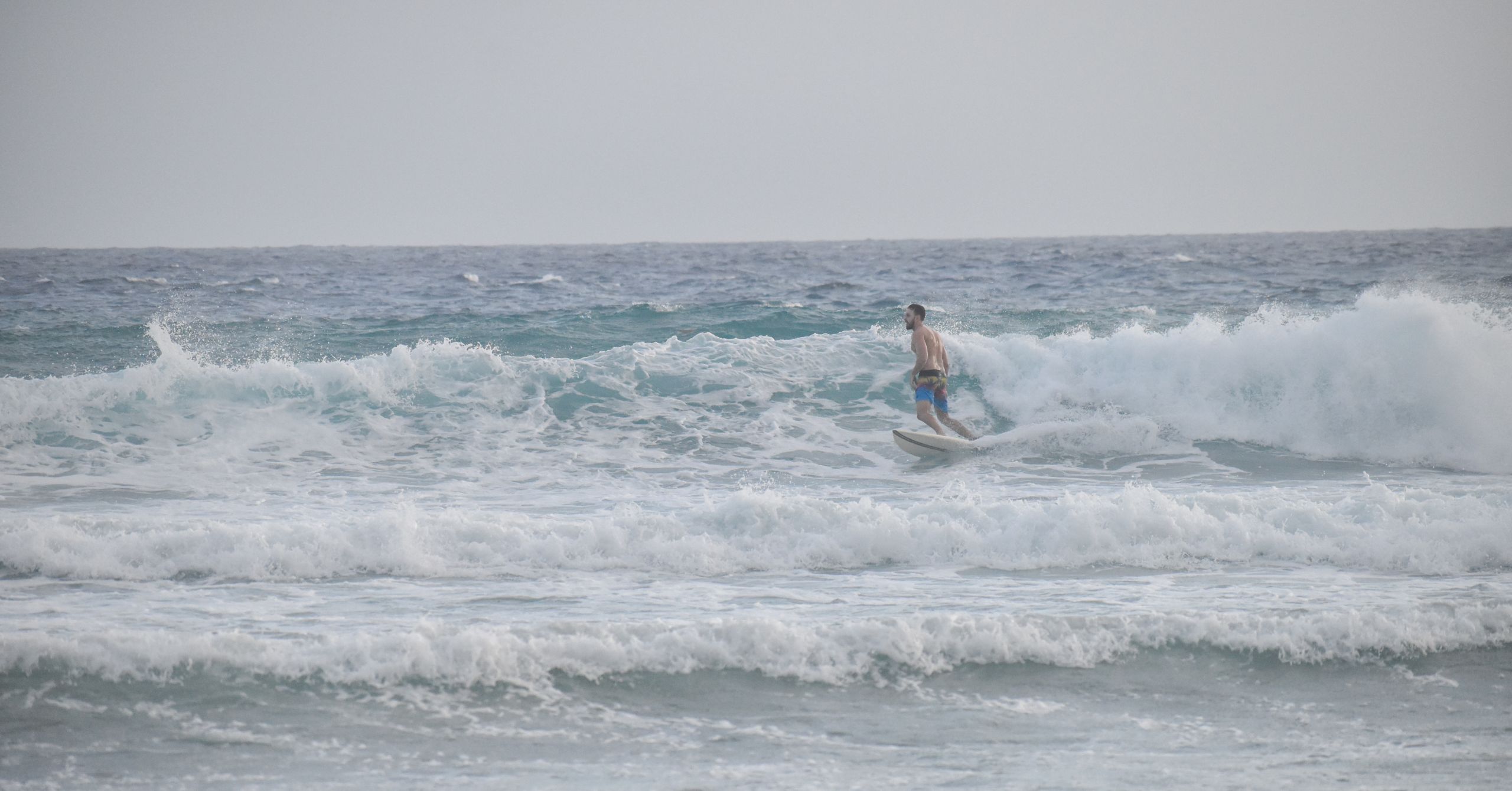 Surfers hit the beach as restrictions ease - Cayman Compass