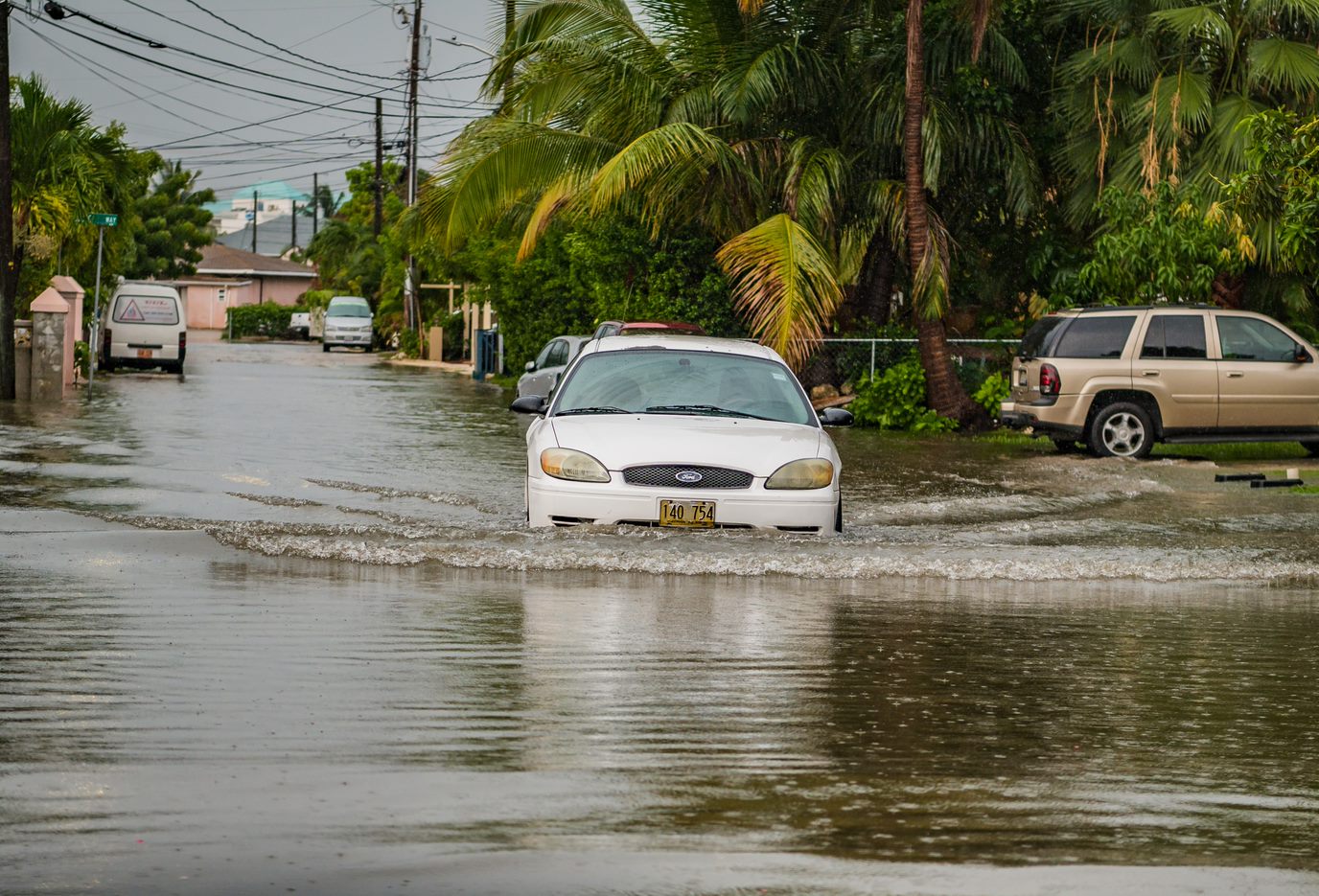 Tropical wave causes power outage and flooding - Cayman Compass