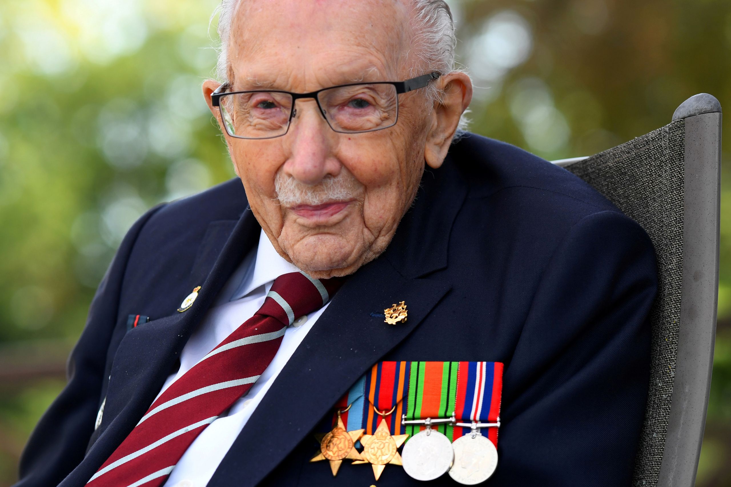 UK's record-breaking fundraiser Captain Tom Moore dies aged 100 ...