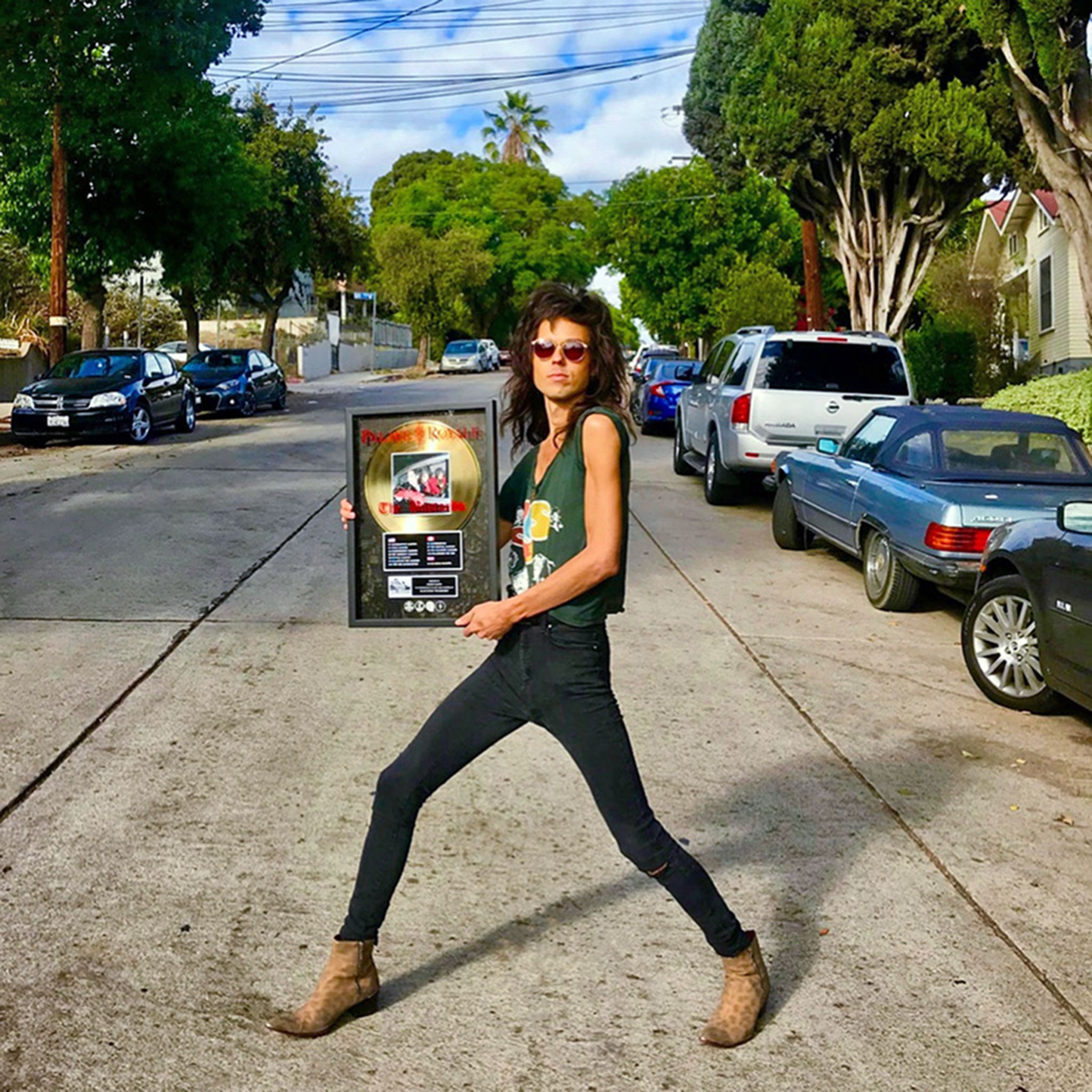 Cayman musician celebrates success (and gold record!) - Cayman Compass