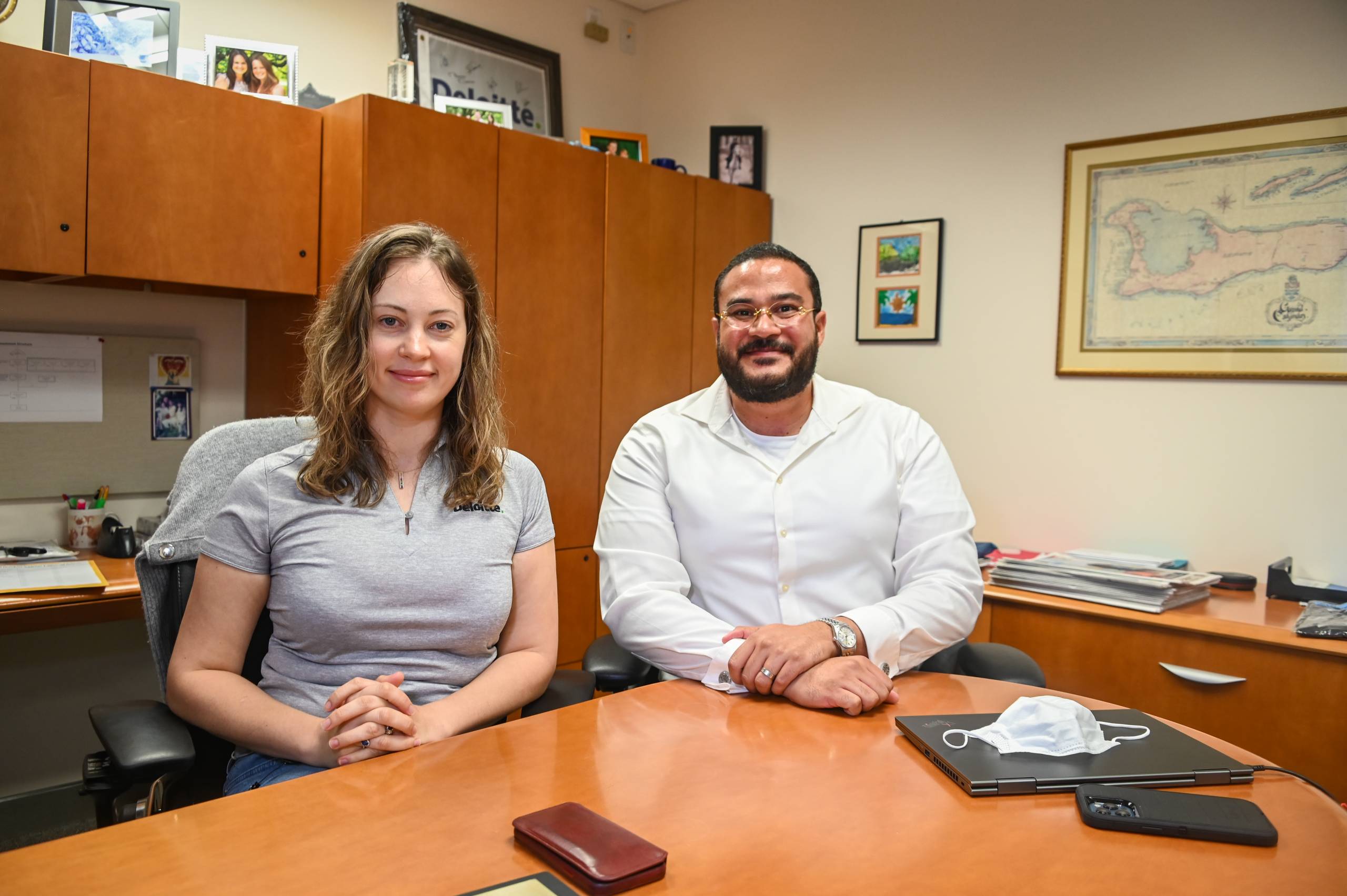 Deloitte 5 - Cayman Compass