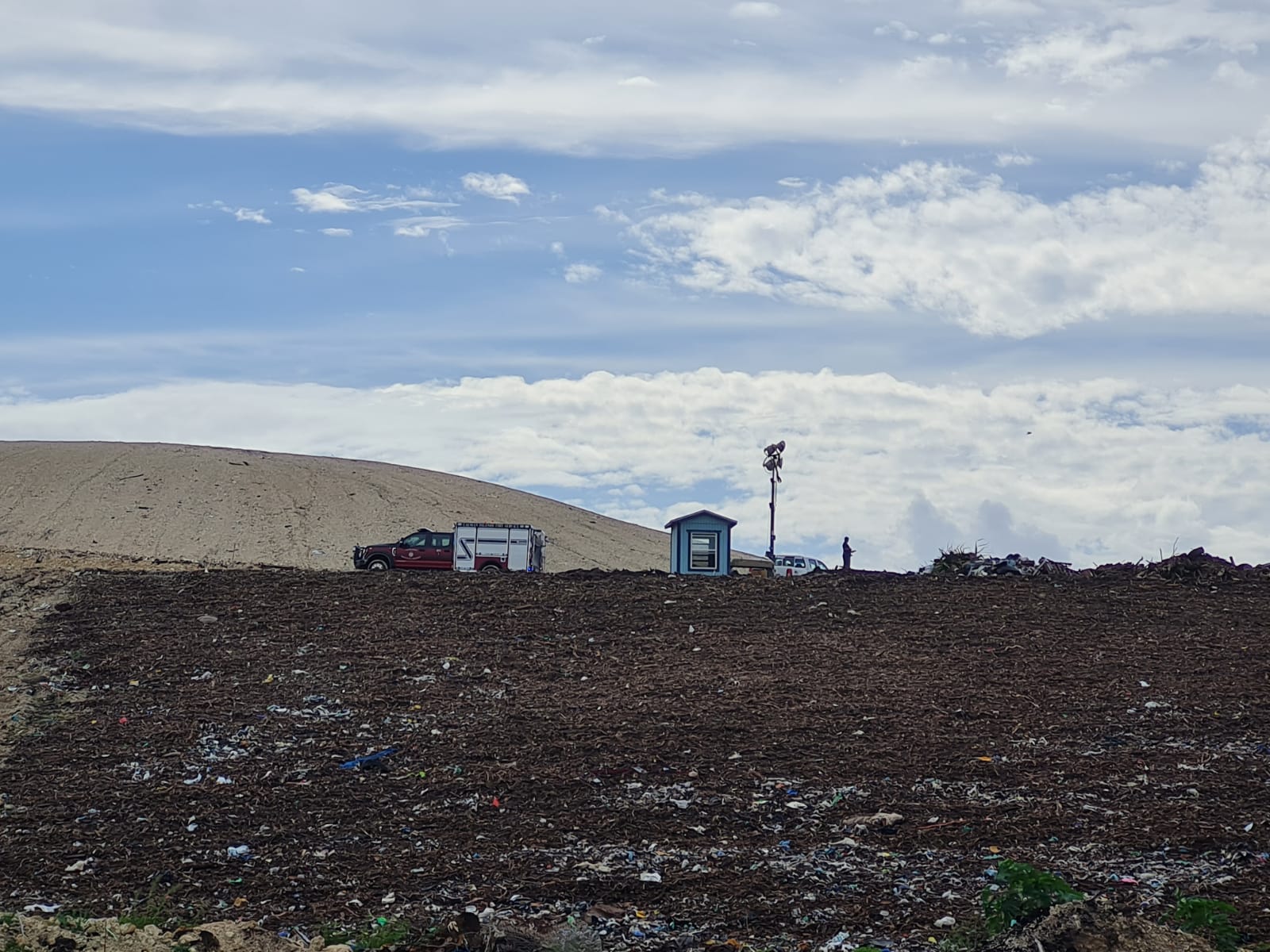 DEH and fire officers monitoring hotspot at landfill - Cayman Compass