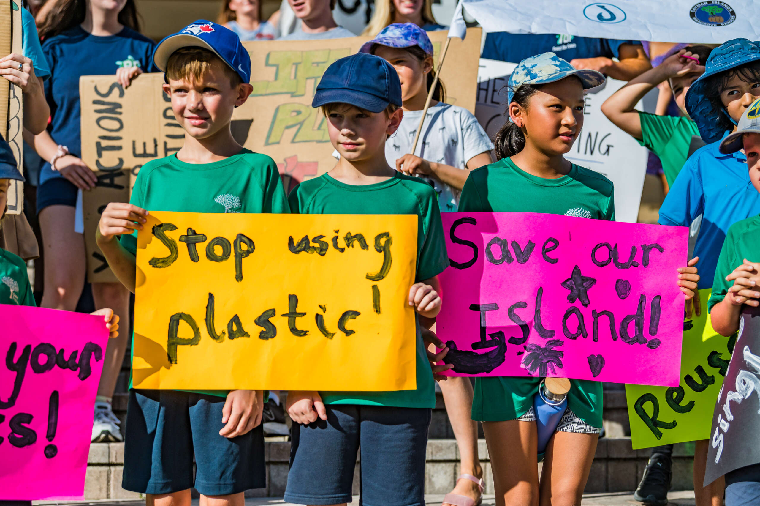 Students march in protest against single use plastics - Cayman Compass