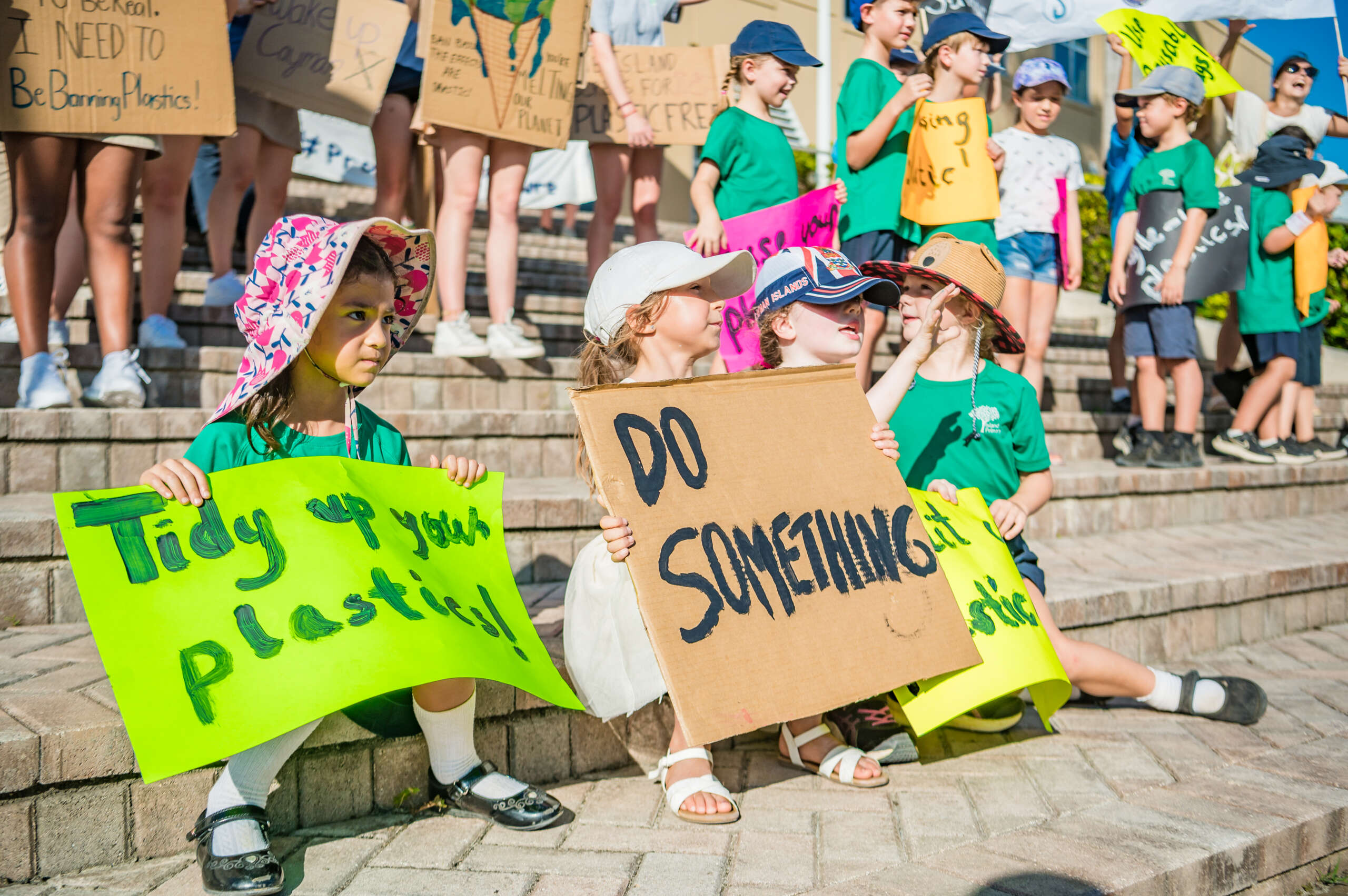 Students march in protest against single use plastics - Cayman Compass