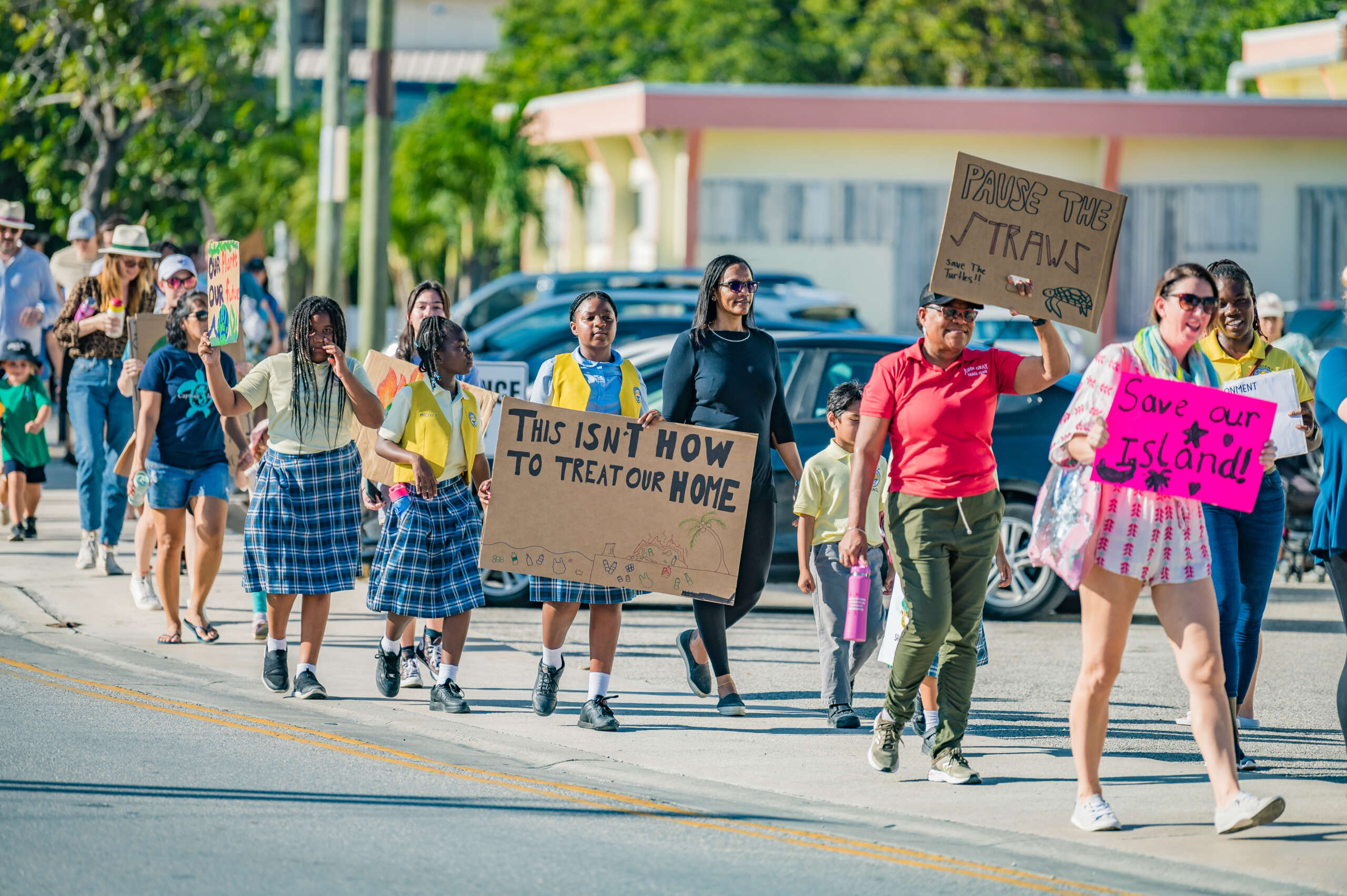 Students march in protest against single use plastics - Cayman Compass