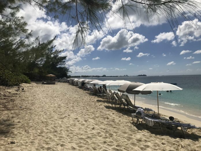 Marriott bussing guests to Dart beach - Cayman Compass