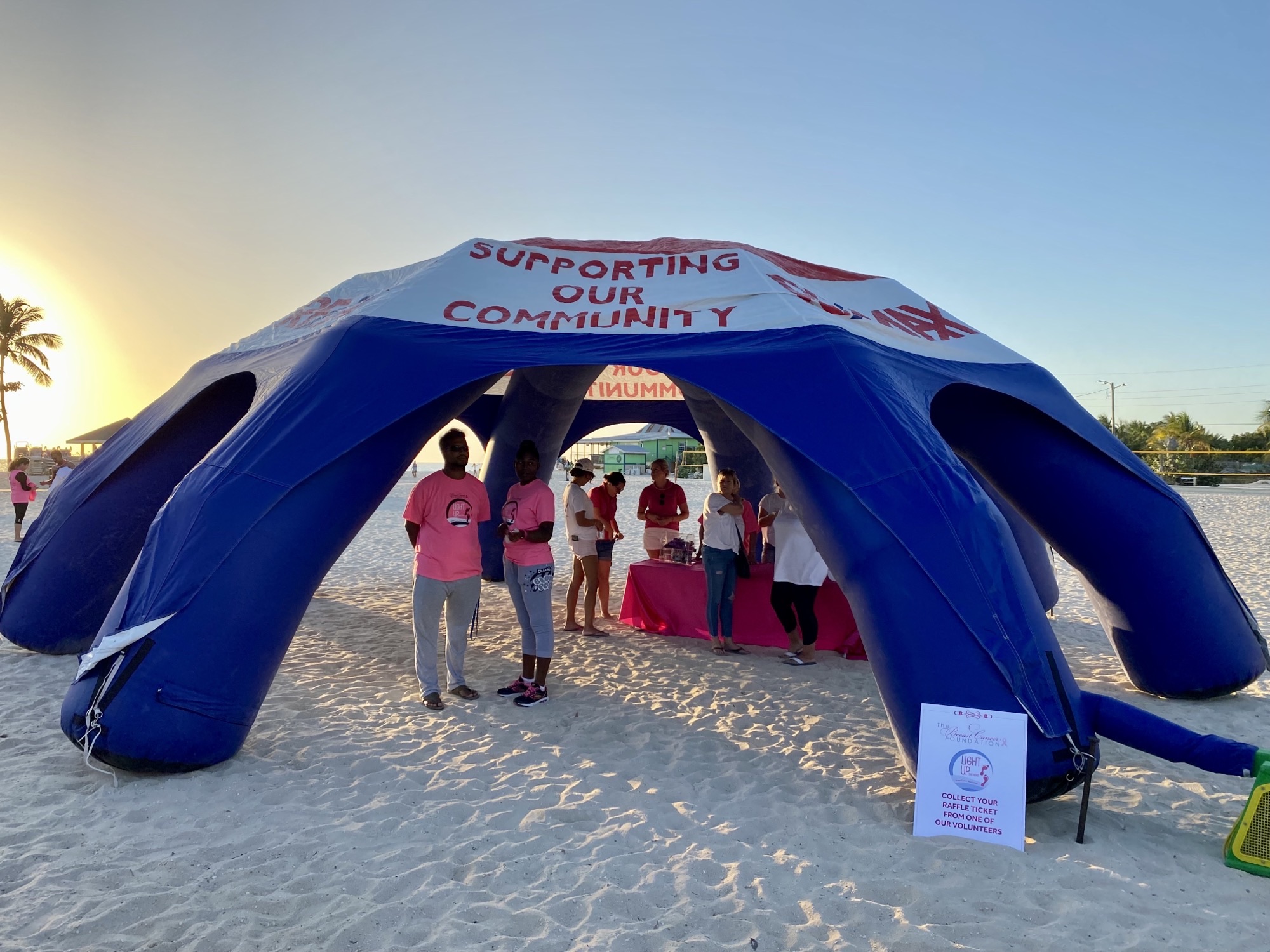 Breast cancer beach walk attracts record numbers - Cayman Compass