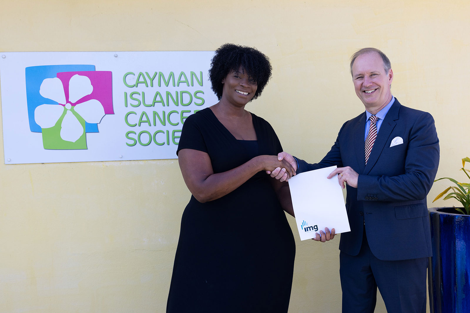 IMG raises $10,000 for four local charities - Cayman Compass