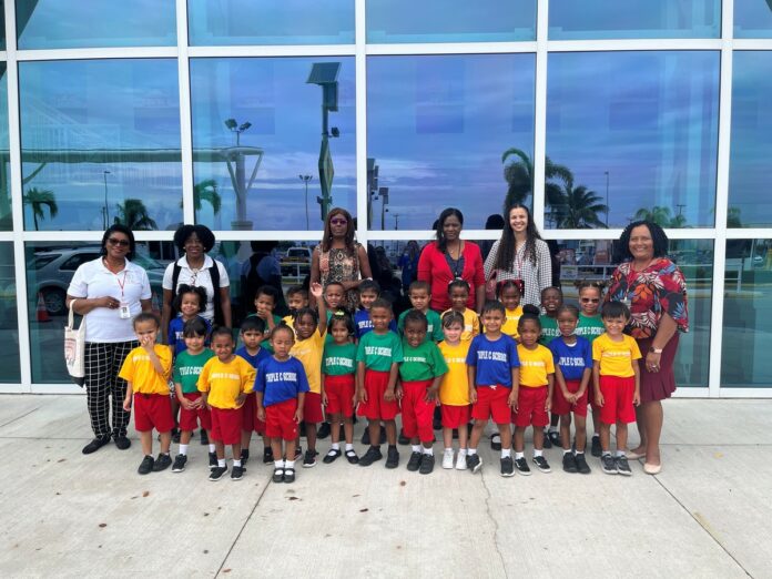 Triple C School students tour airport terminal - Cayman Compass