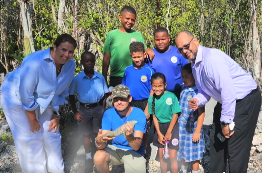 Prince-Charles-meets-a-blue-iguana - Cayman Compass