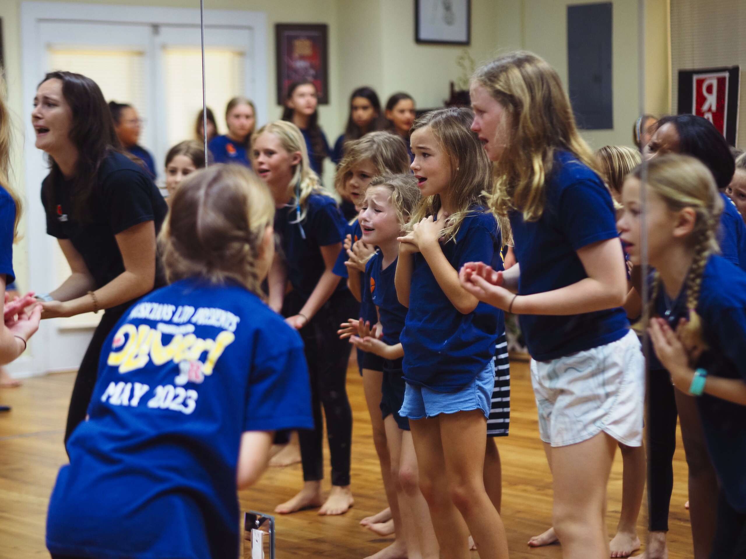 The cast singing 'Food Glorious Food'. - Cayman Compass