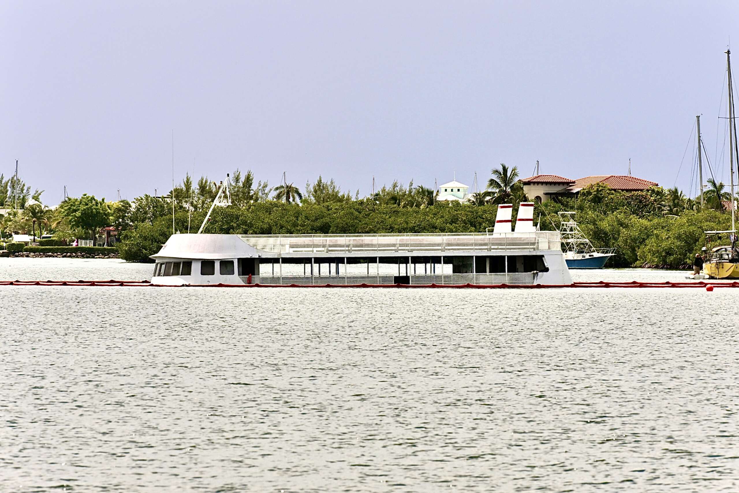 Barrier placed around sunken boat to protect marine life - Cayman Compass