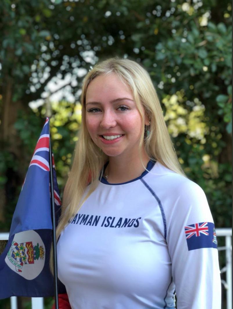 Charlotte Webster with Cayman flag - Cayman Compass