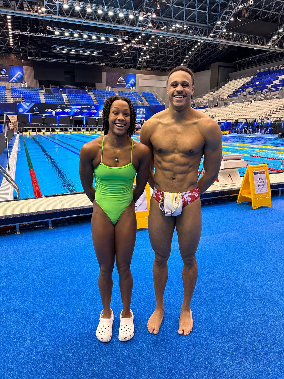 Jillian and Jordan Crooks at pool in Fukuoka - Cayman Compass