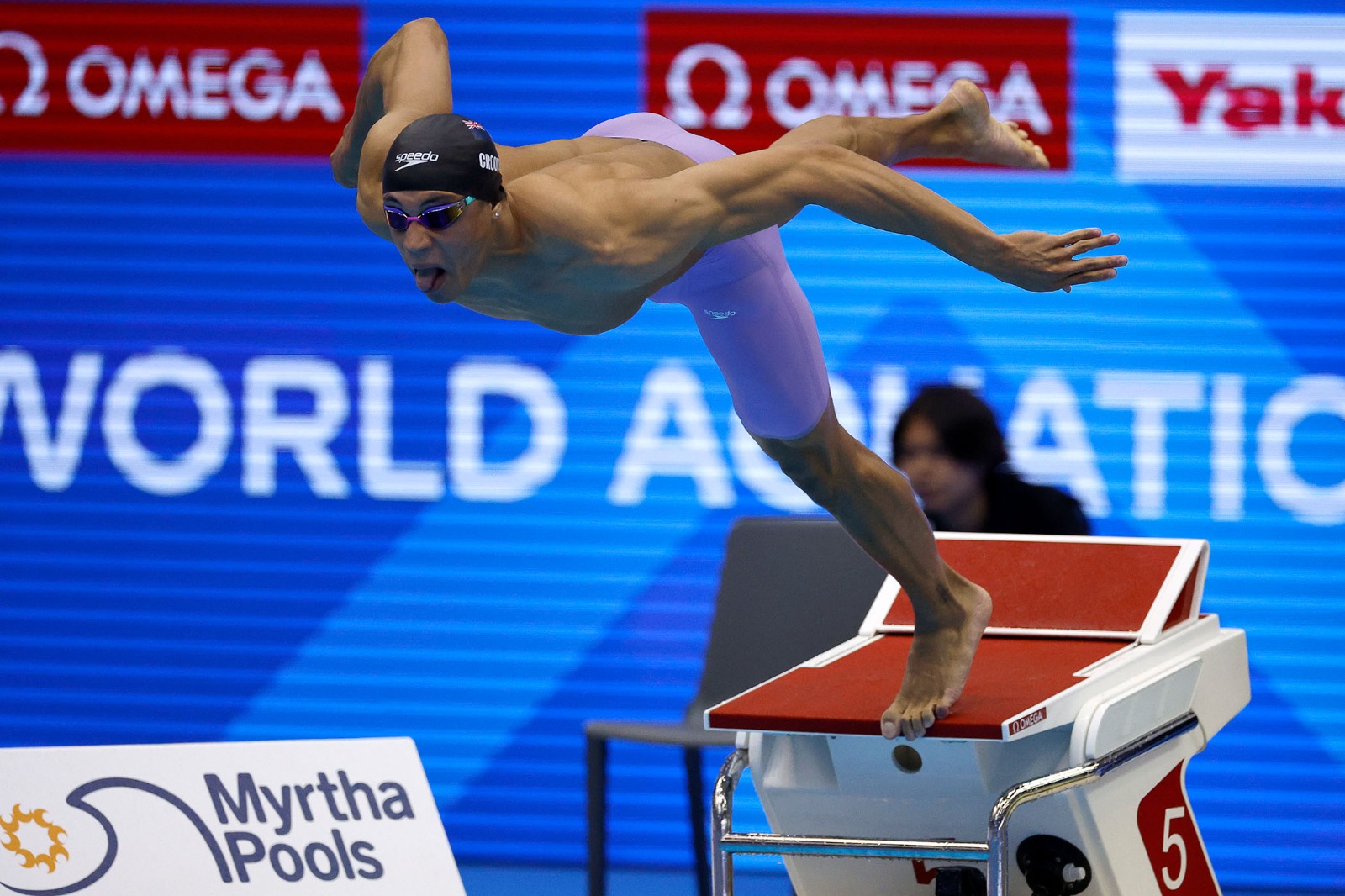 Jordan Crooks dive 100m free 2023 Worlds - Cayman Compass