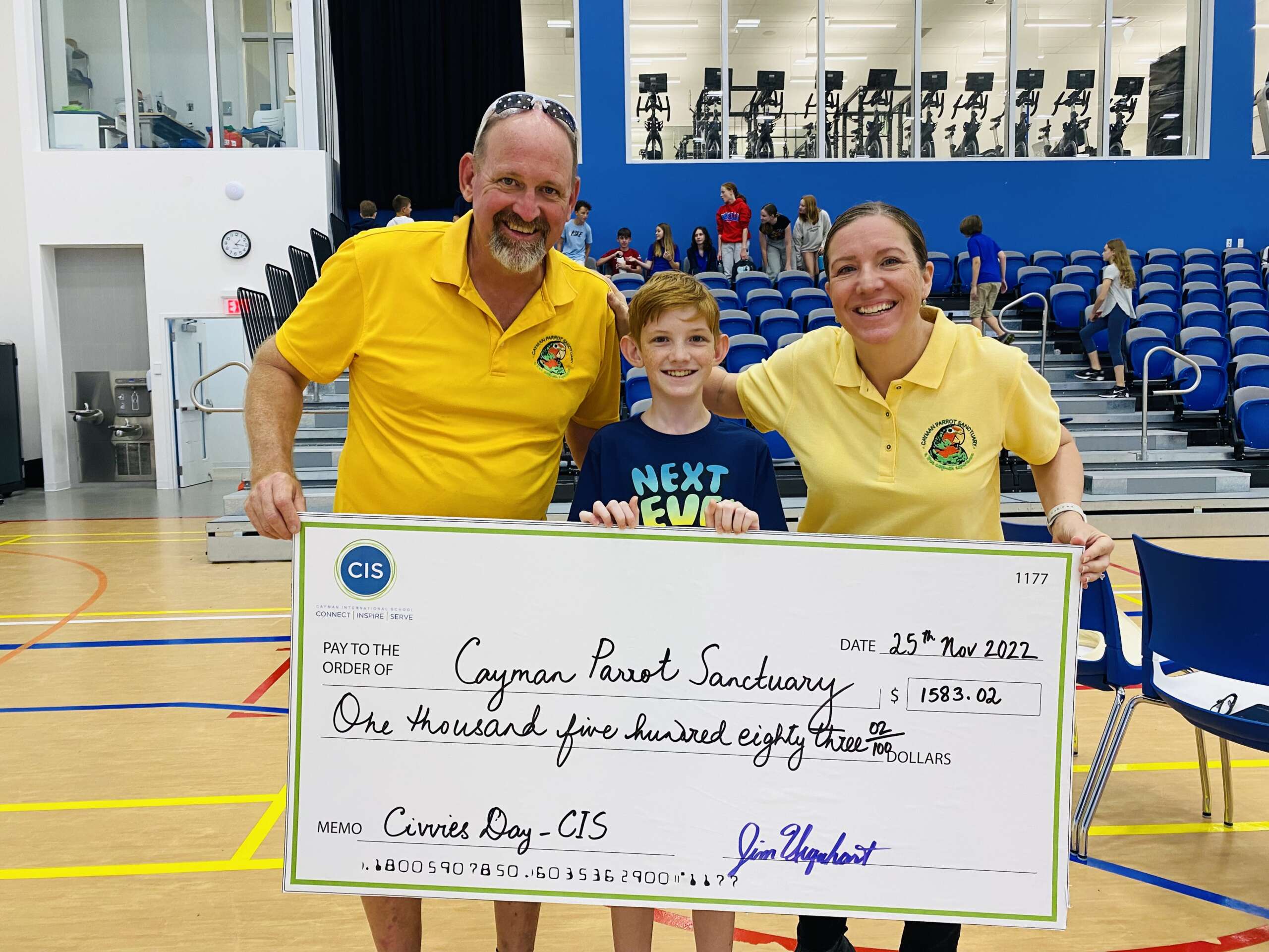 CIS kids help release Cayman parrot into the wild - Cayman Compass