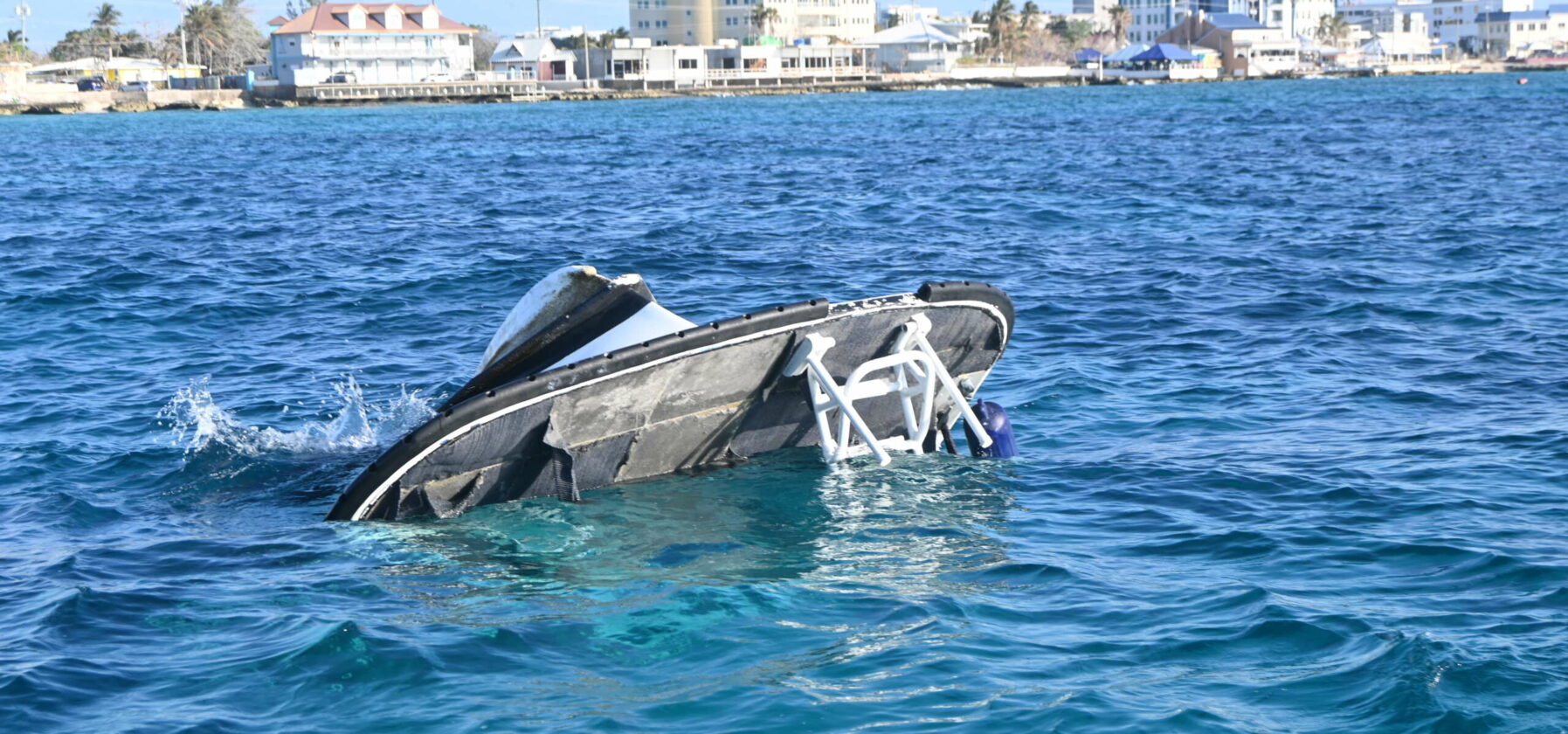 Tug-boat captain rescues man from sinking boat - Cayman Compass