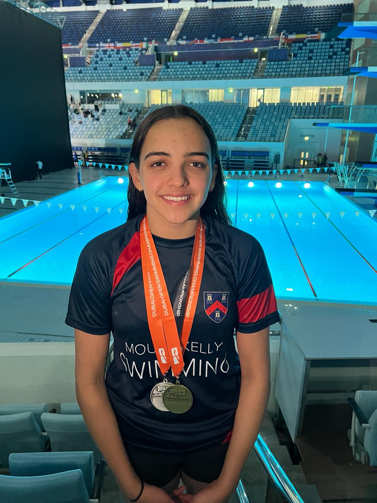 Sierrah Broadbelt swims to gold in Dubai - Cayman Compass