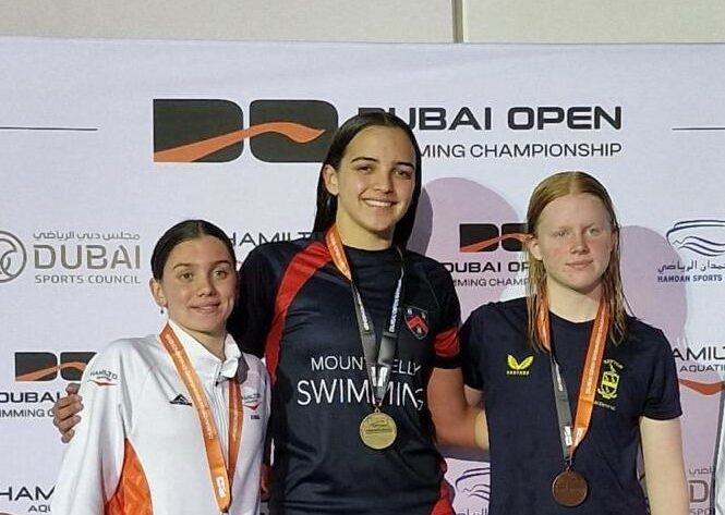 Sierrah Broadbelt swims to gold in Dubai - Cayman Compass