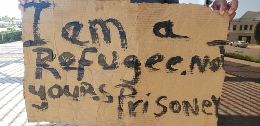 Protest outside government offices ends in arrest - Cayman Compass