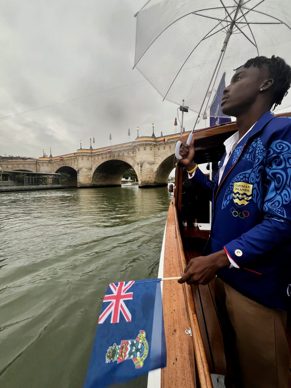 Team Cayman brings the style as Olympics opens on rainy night in Paris ...