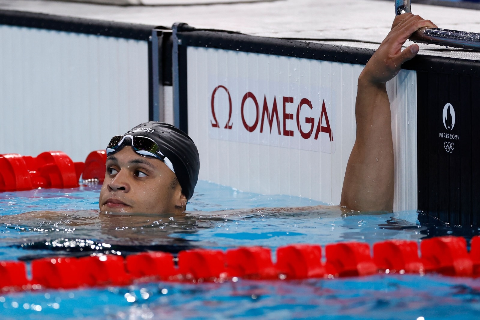 Crooks a split-second from glory in valiant Olympic effort - Cayman Compass