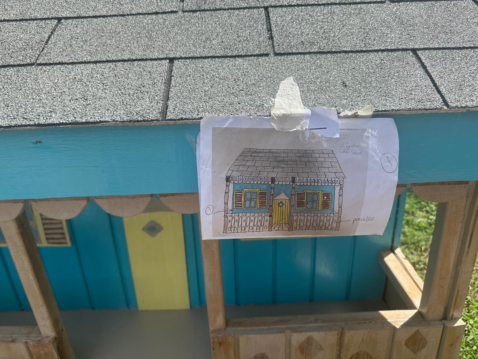 Miniature Cayman cottages return to West Bay roadsides - Cayman Compass