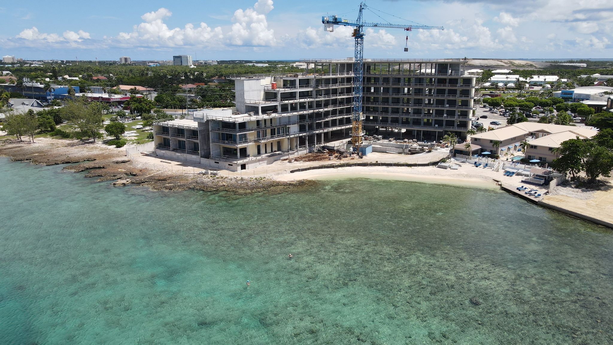NCB Group Celebrates Hotel Roof Topping - Cayman Compass