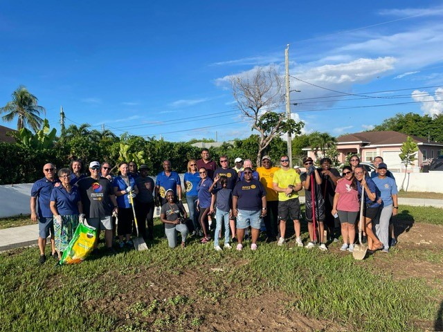 Community clubs collaborate for historic tree planting project - Cayman ...