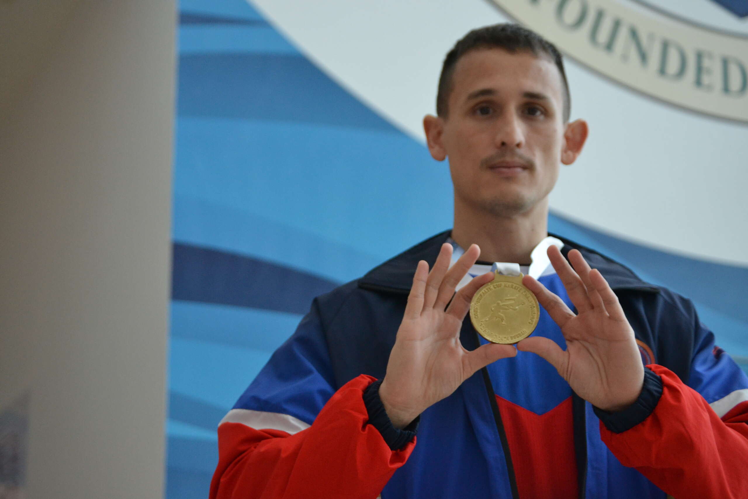 Nick Young wins Cayman’s first Commonwealth gold in karate - Cayman Compass