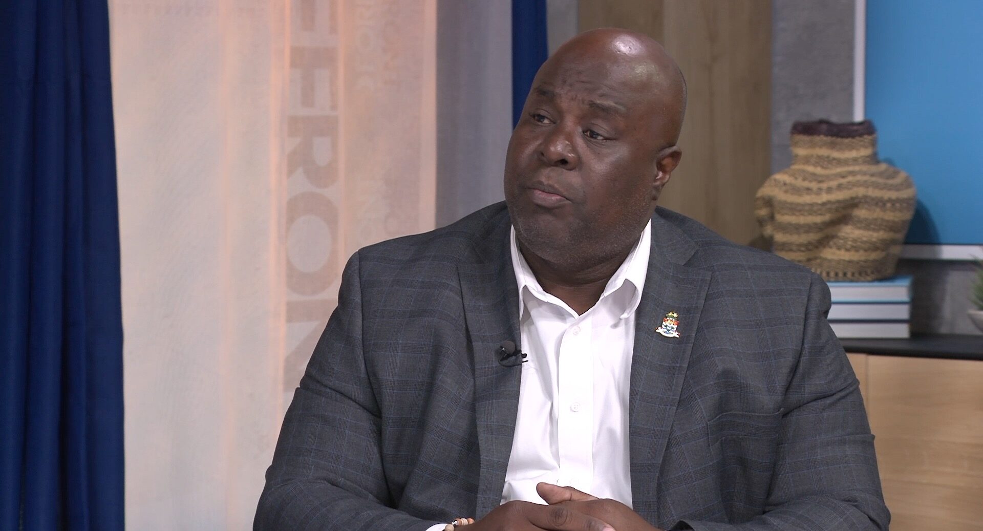 Immigration minister calls for 22-year wait for Caymanian status ...