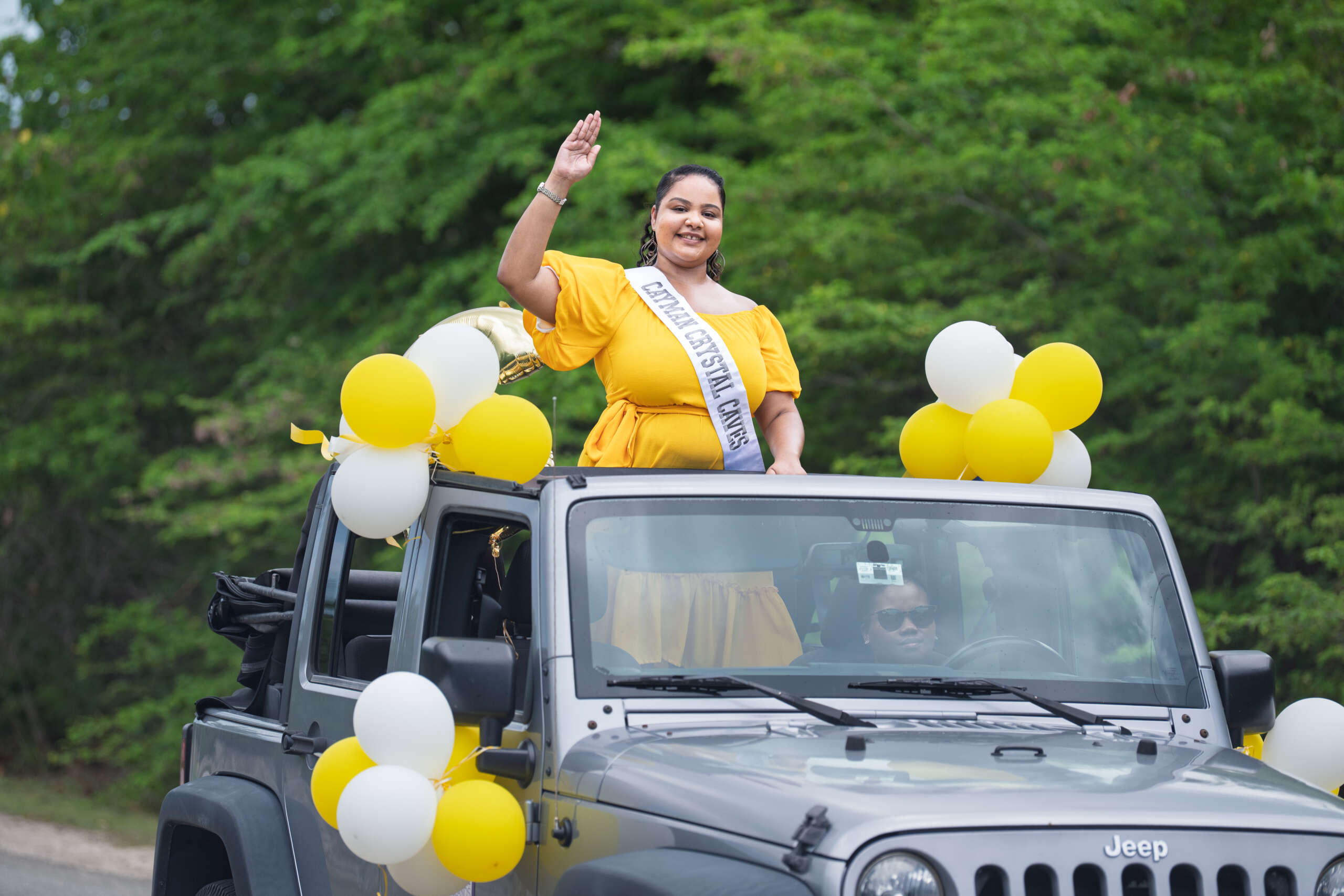 Pageant contestants tour Cayman in annual motorcade - Cayman Compass